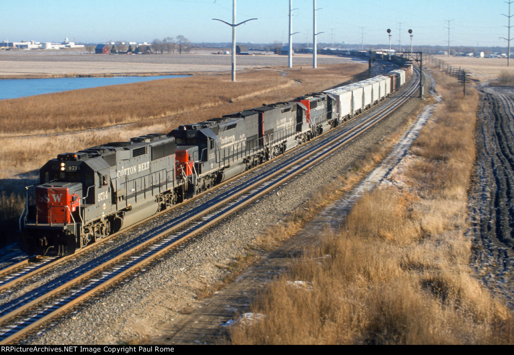 SSW 9714, leads a nice consist of, GP60, SD40T-2, SD40T-2, GP60 westbound on the BN on Christmas Day